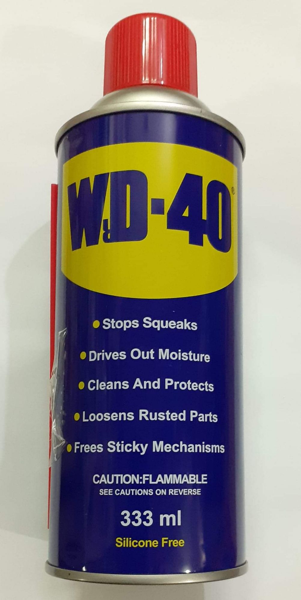 WD-40 Stops Squeaks Drives Out Moisture Cleans And Protects Loosens ...